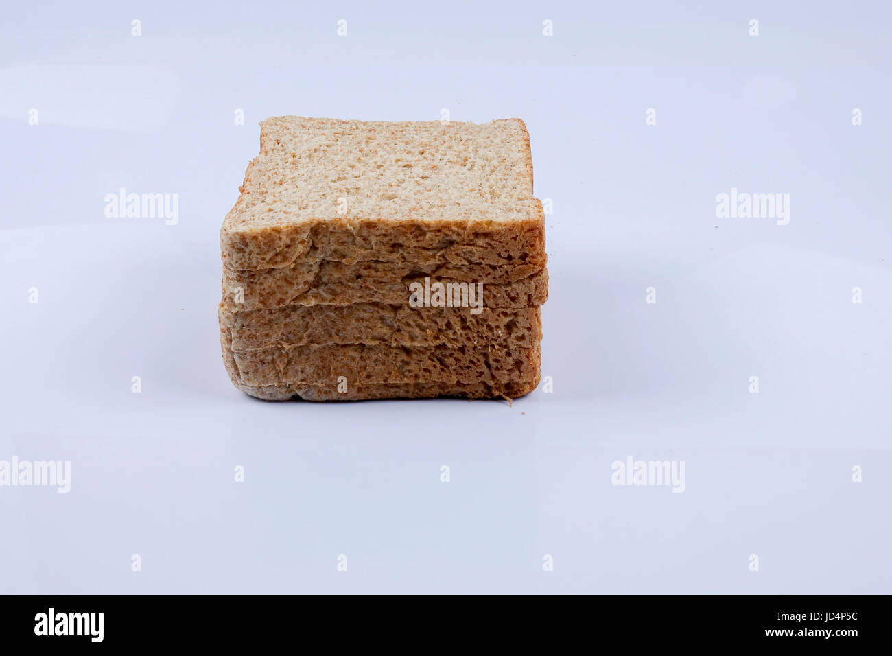 Loaf of wholemeal bread on white background Stock Photo - Alamy