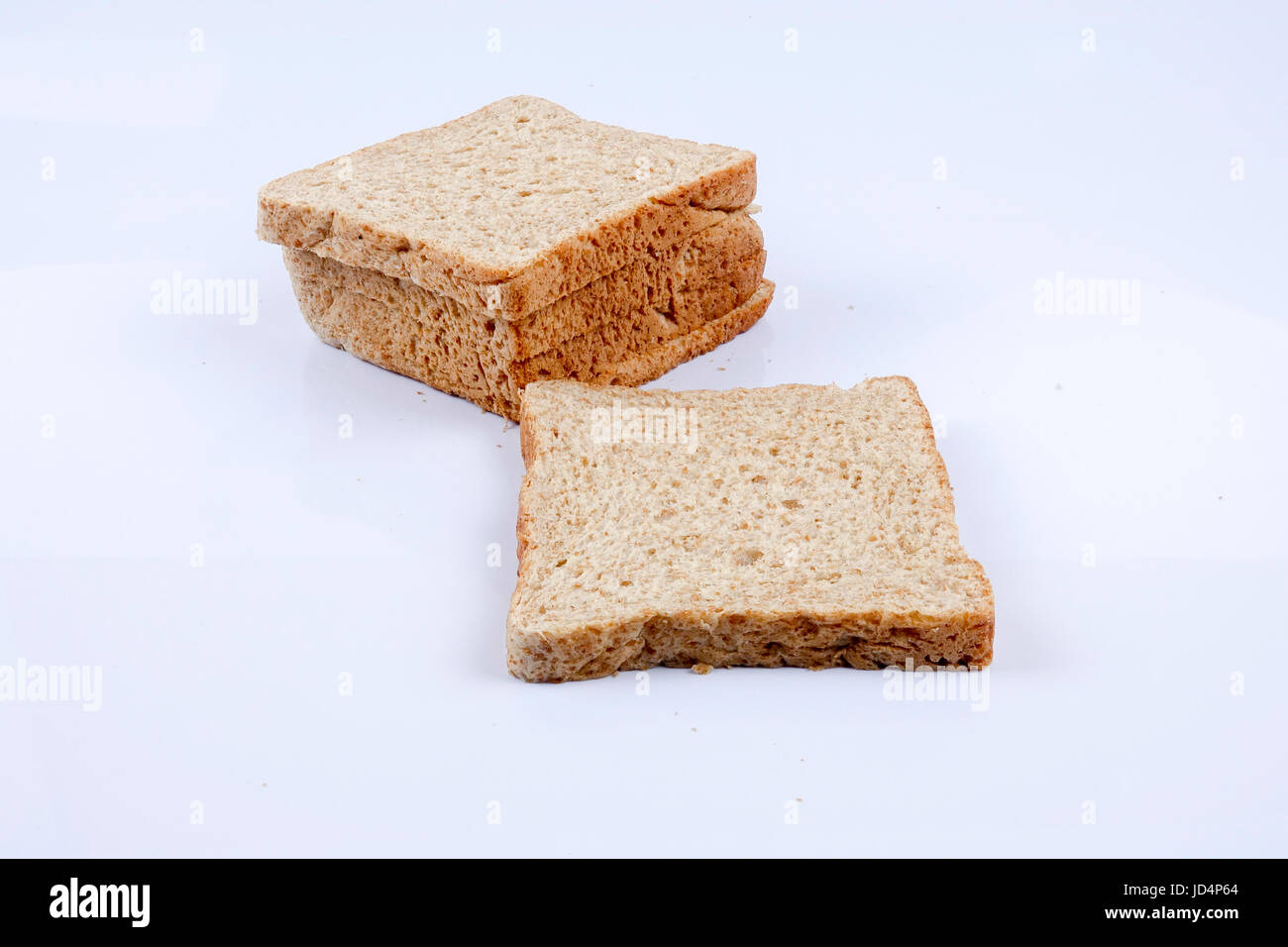 Loaf of wholemeal bread on white background Stock Photo - Alamy