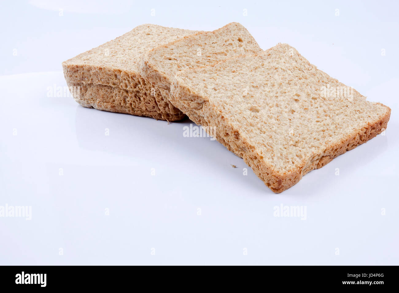 Loaf of wholemeal bread on white background Stock Photo - Alamy