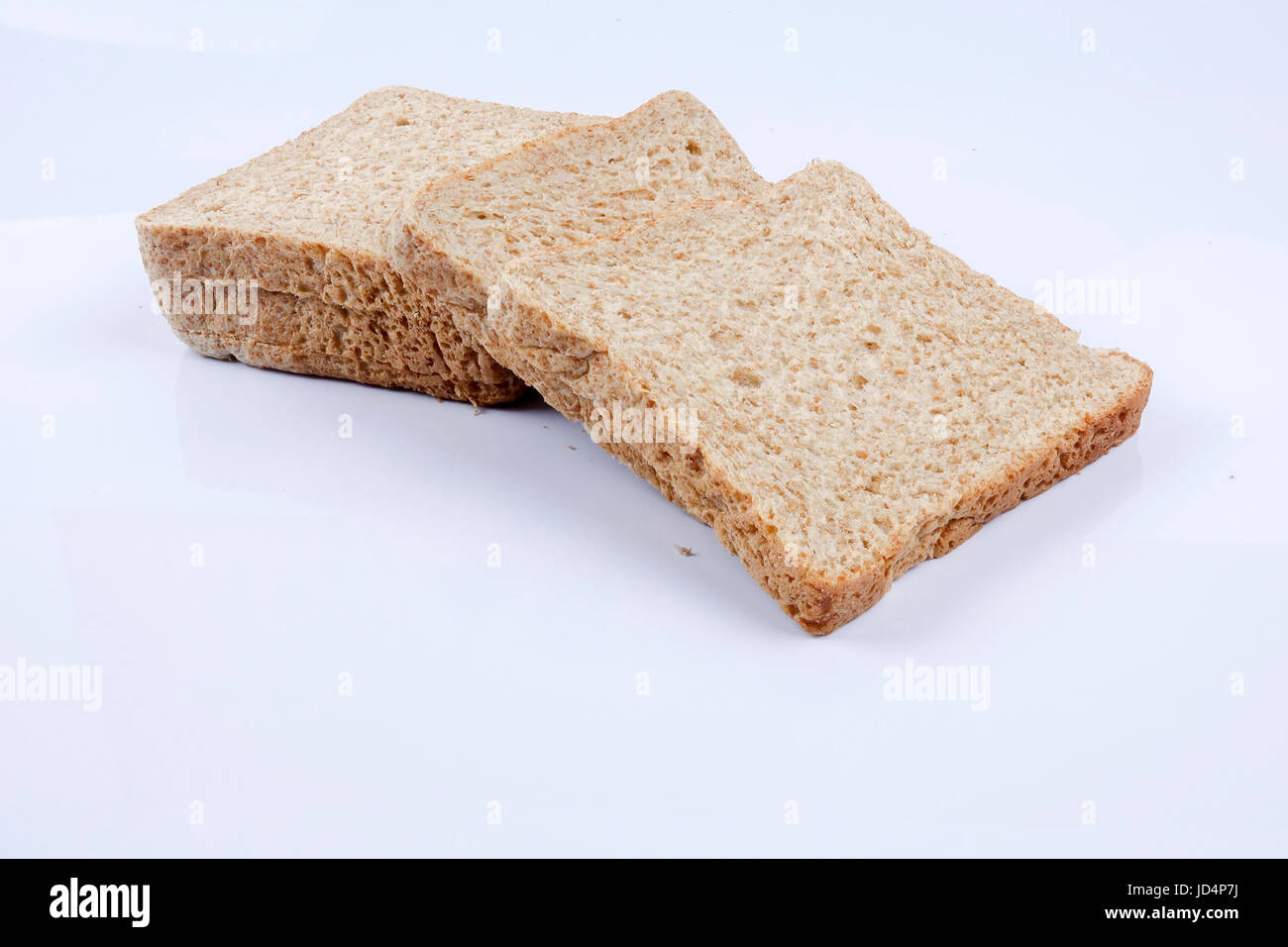 Loaf of wholemeal bread on white background Stock Photo - Alamy