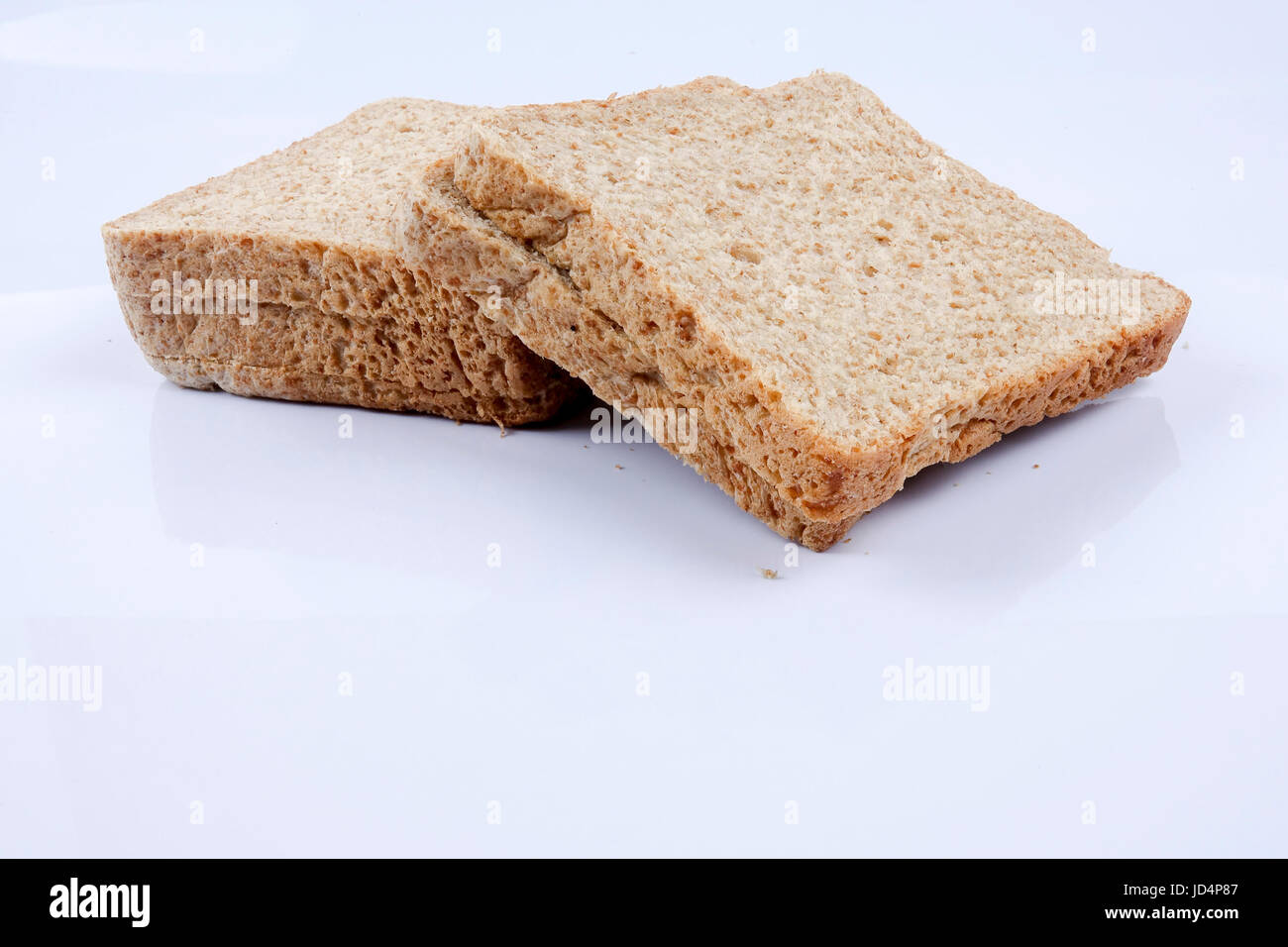 Loaf of wholemeal bread on white background Stock Photo - Alamy