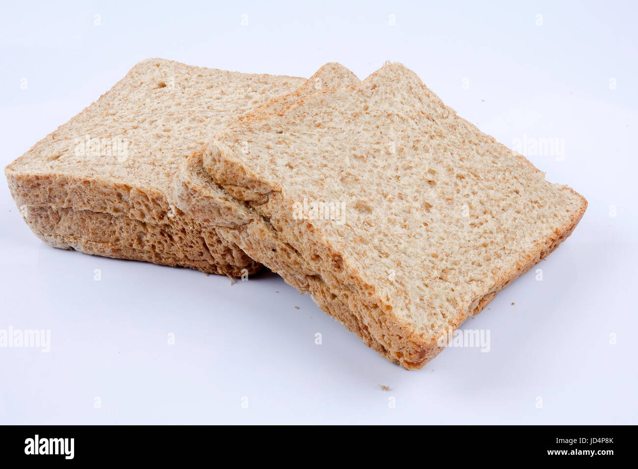 Loaf of wholemeal bread on white background Stock Photo - Alamy