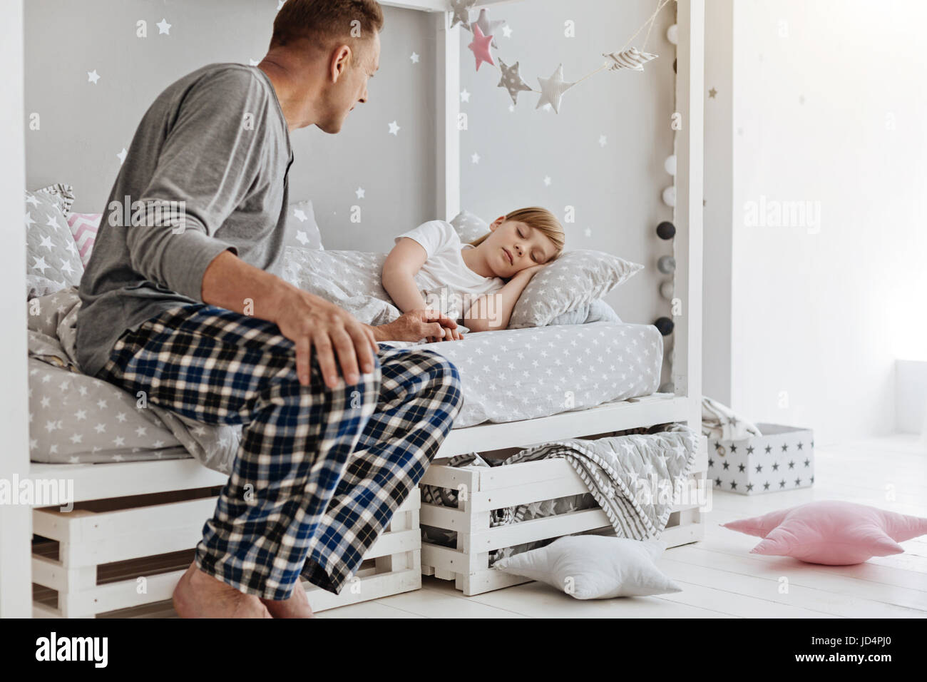 Loving careful dad carefully waking his child up Stock Photo - Alamy