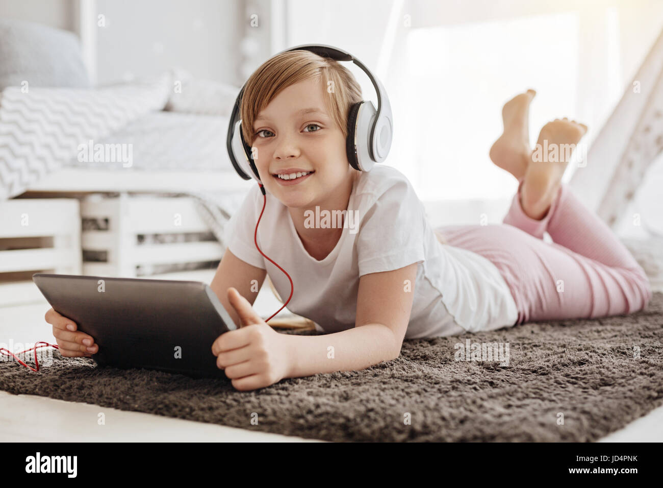 Imaginative joyful child watching cartoons Stock Photo - Alamy