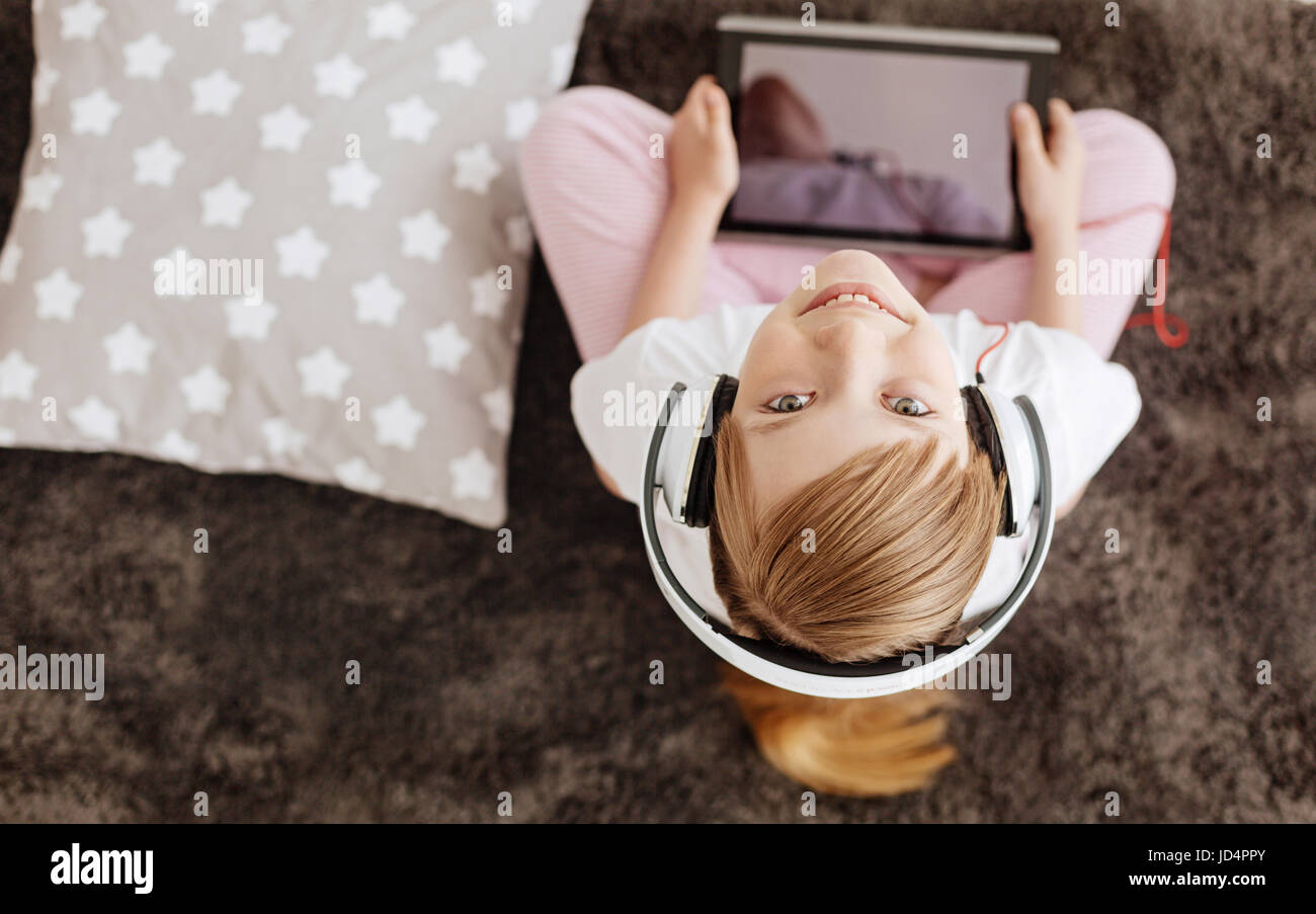 Beautiful intelligent girl entertaining herself Stock Photo - Alamy