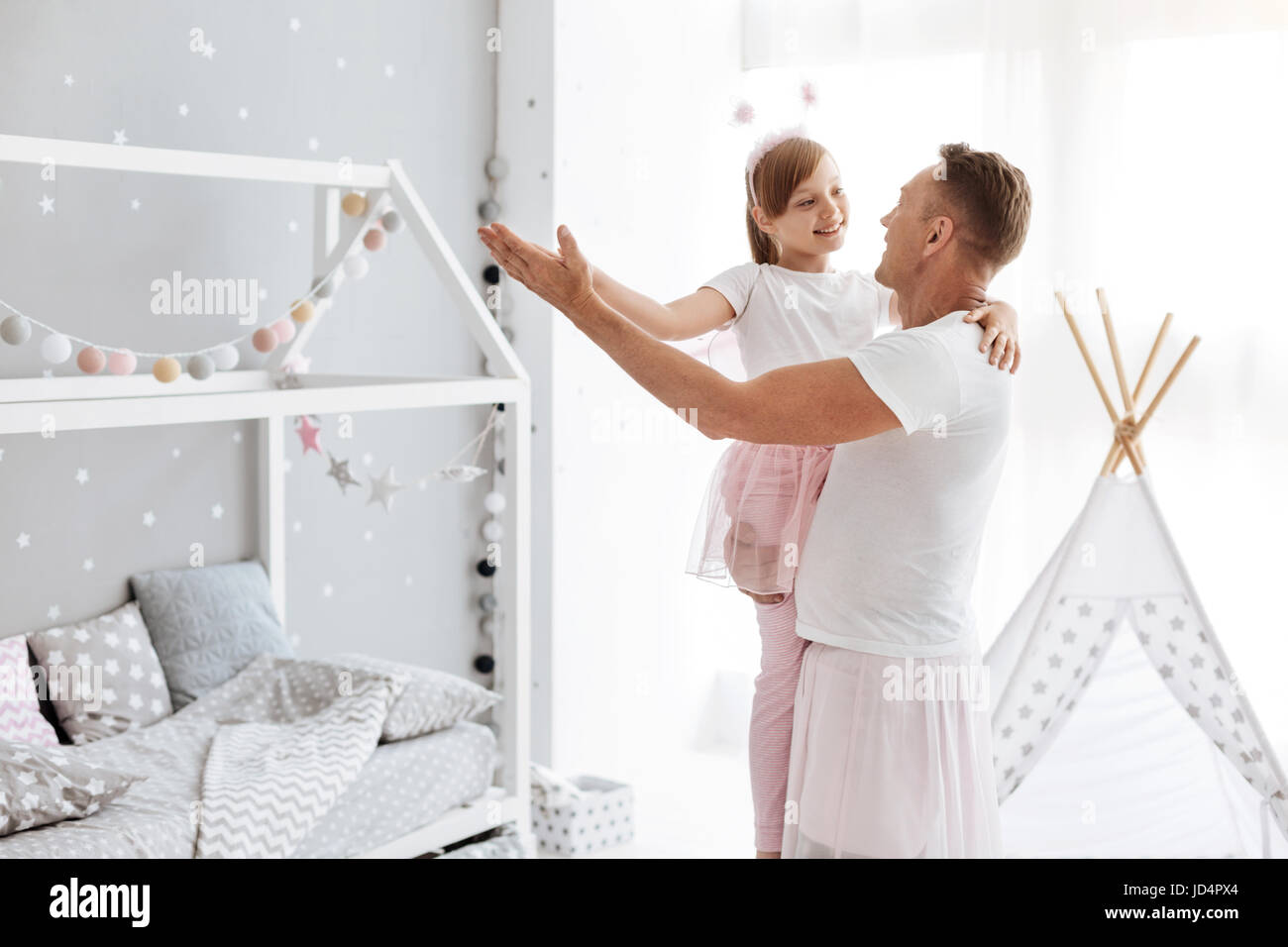 Admirable loving dad dancing with his little fairy Stock Photo - Alamy