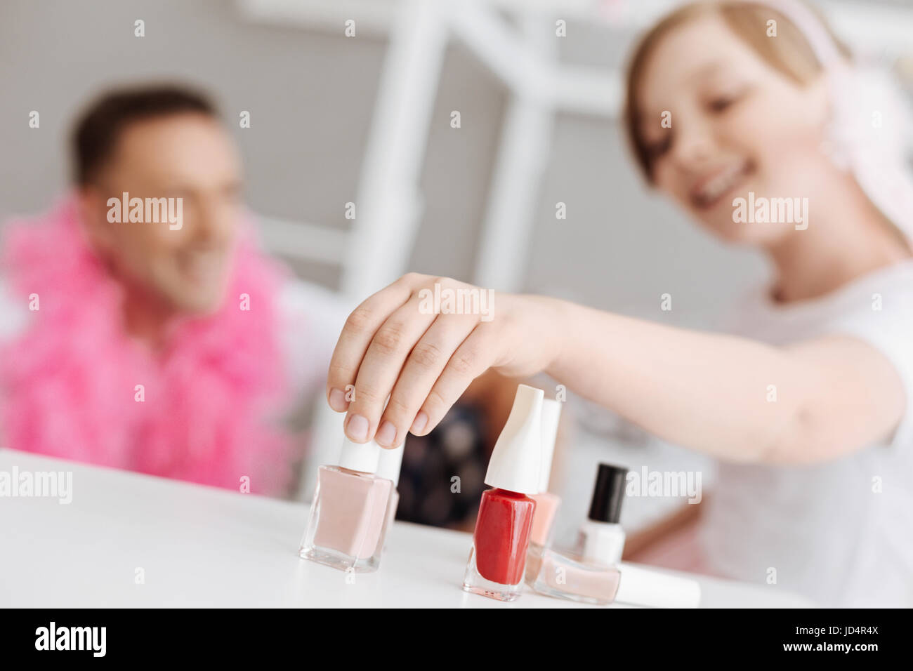 Creative dreamy child doing nails Stock Photo - Alamy