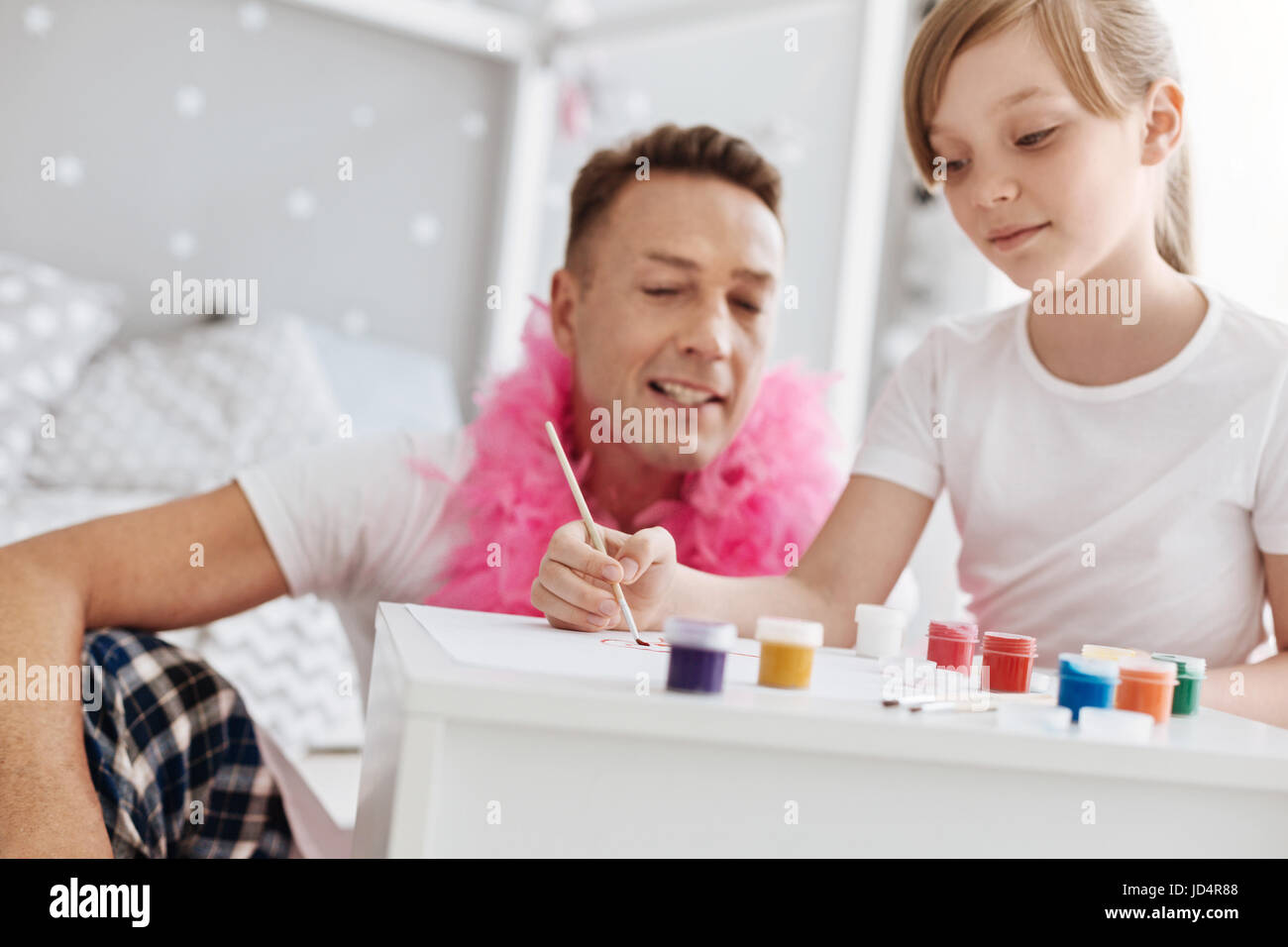 Talented productive child painting with her dad Stock Photo - Alamy