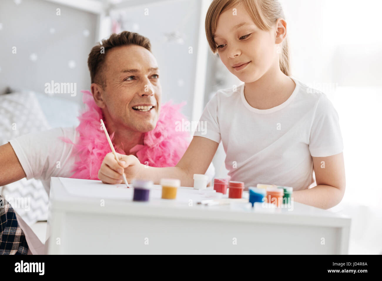 Incredible original girl having a good time drawing Stock Photo - Alamy