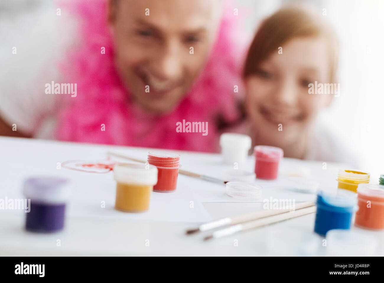 Diligent creative family choosing right colors Stock Photo - Alamy