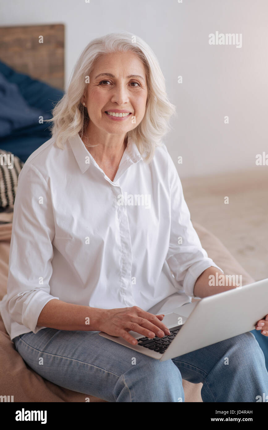 Happy positive woman pressing a button Stock Photo - Alamy