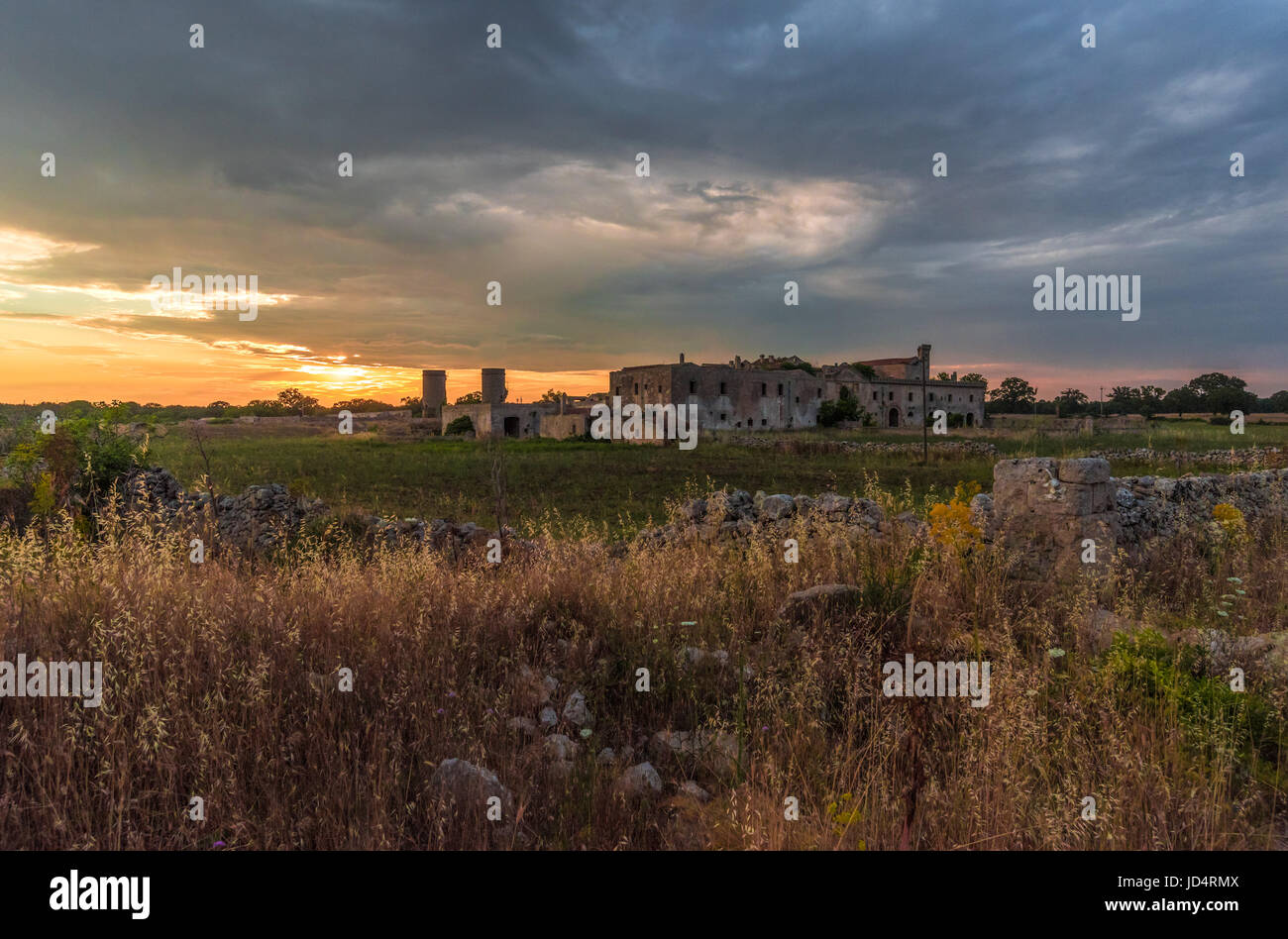 Puglia (Italy) - Wind farm with rock ruins, wind turbines and bales of ...