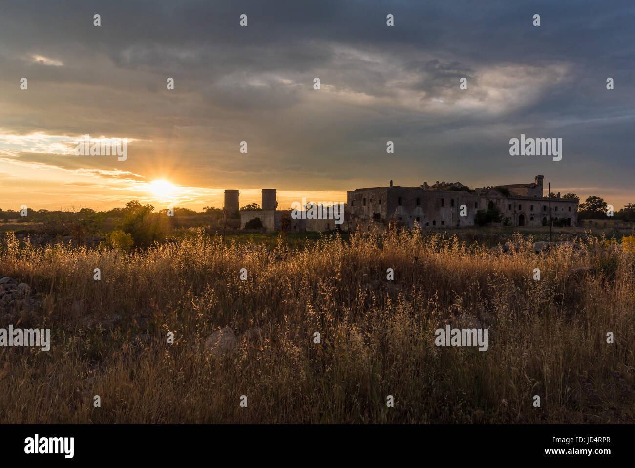 Puglia (Italy) - Wind farm with rock ruins, wind turbines and bales of ...