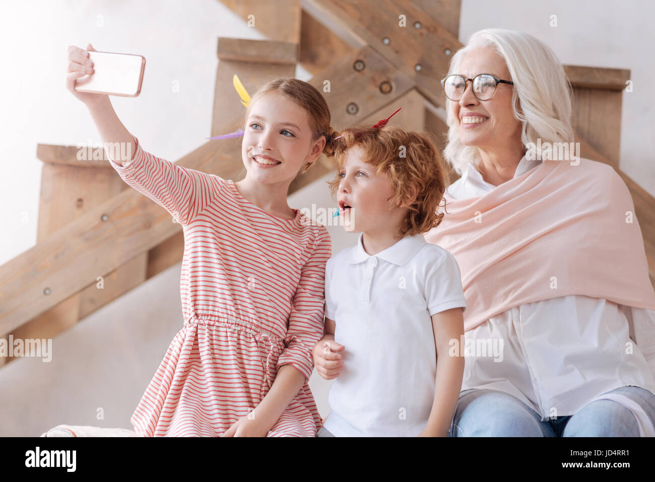Cute delighted girl taking a selfie Stock Photo - Alamy