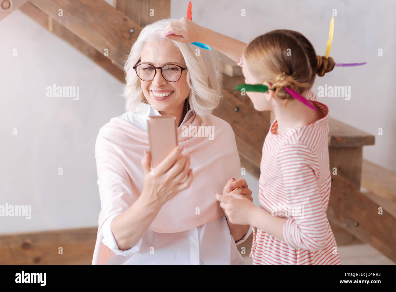 Happy delighted woman looking posing for a photo Stock Photo - Alamy
