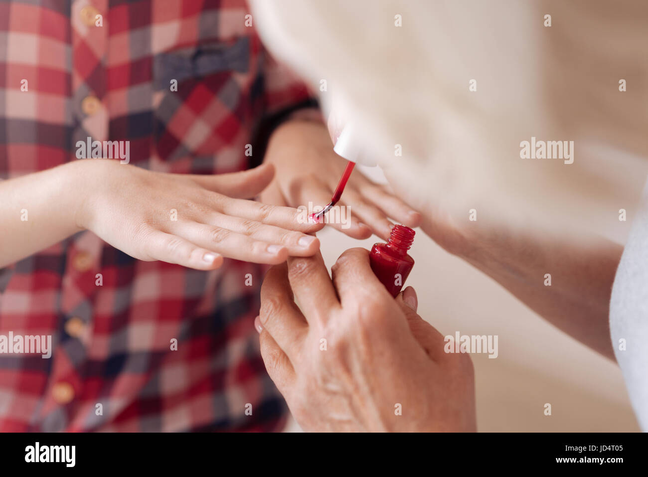 Close up of girls nails being painted Stock Photo - Alamy