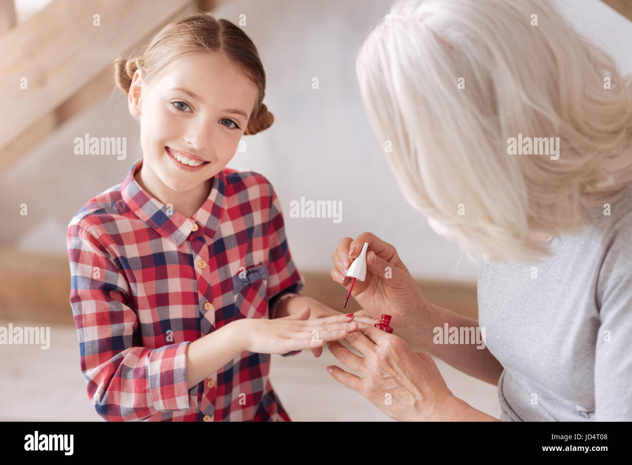 Happy beautiful girl having her nails done Stock Photo - Alamy