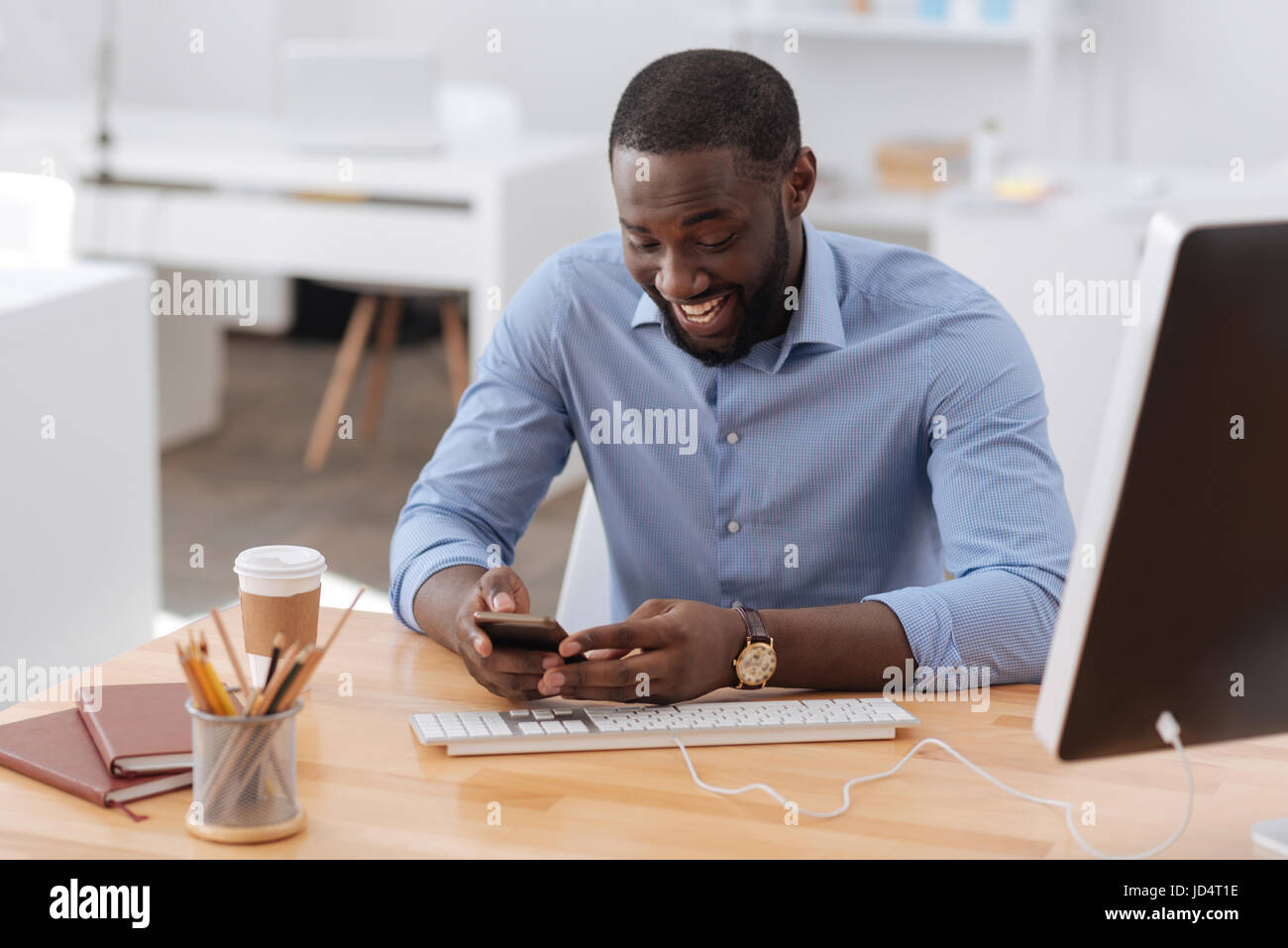 Positive delighted man typing hi-res stock photography and images - Alamy