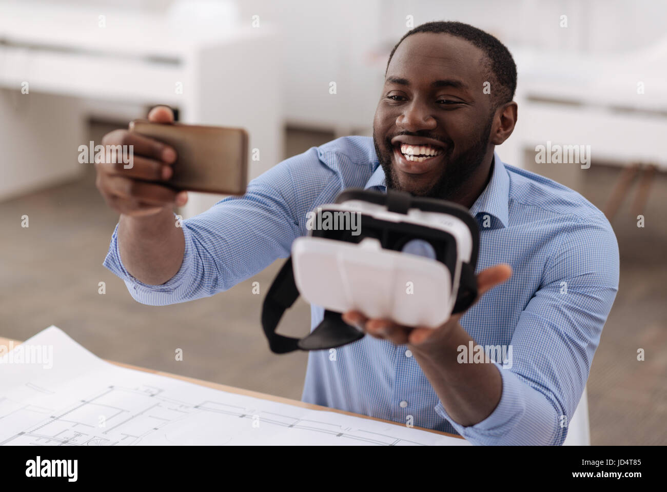 Happy nice man taking a selfie Stock Photo - Alamy