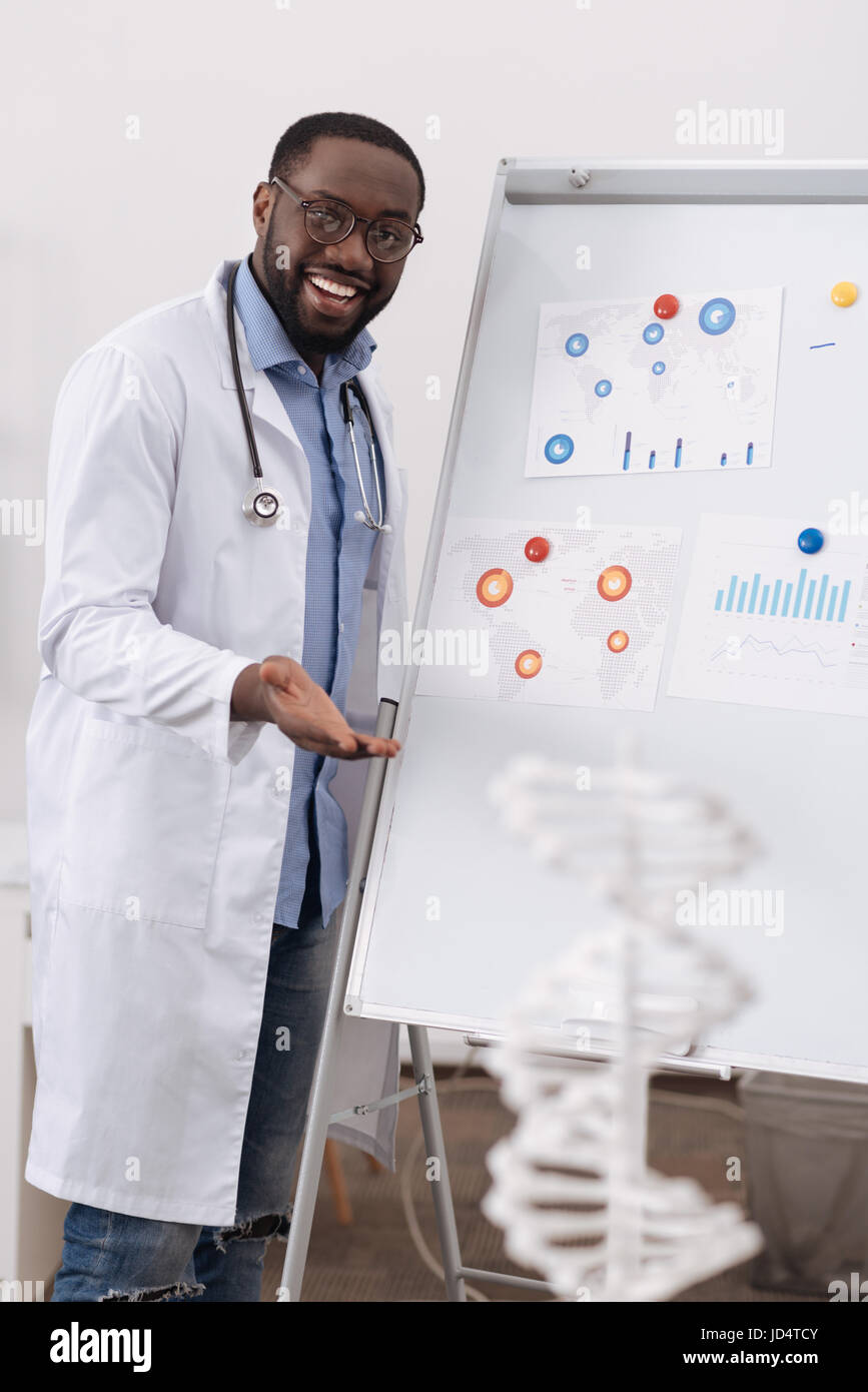 Happy positive scientist standing near the whiteboard Stock Photo - Alamy