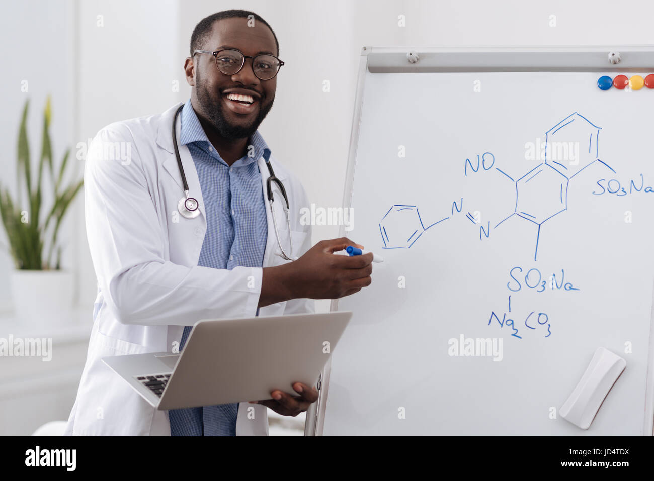Intelligent smart chemist showing you a chemical formula Stock Photo ...