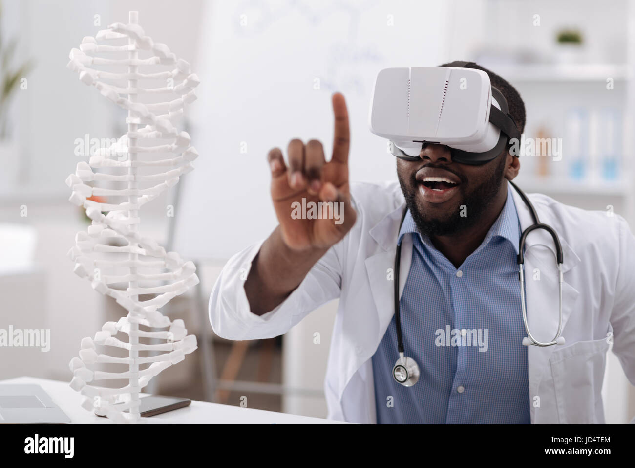 Professional intelligent scientist studying genome Stock Photo - Alamy