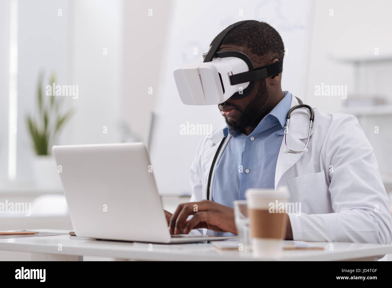 Serious smart man typing on the laptop Stock Photo - Alamy