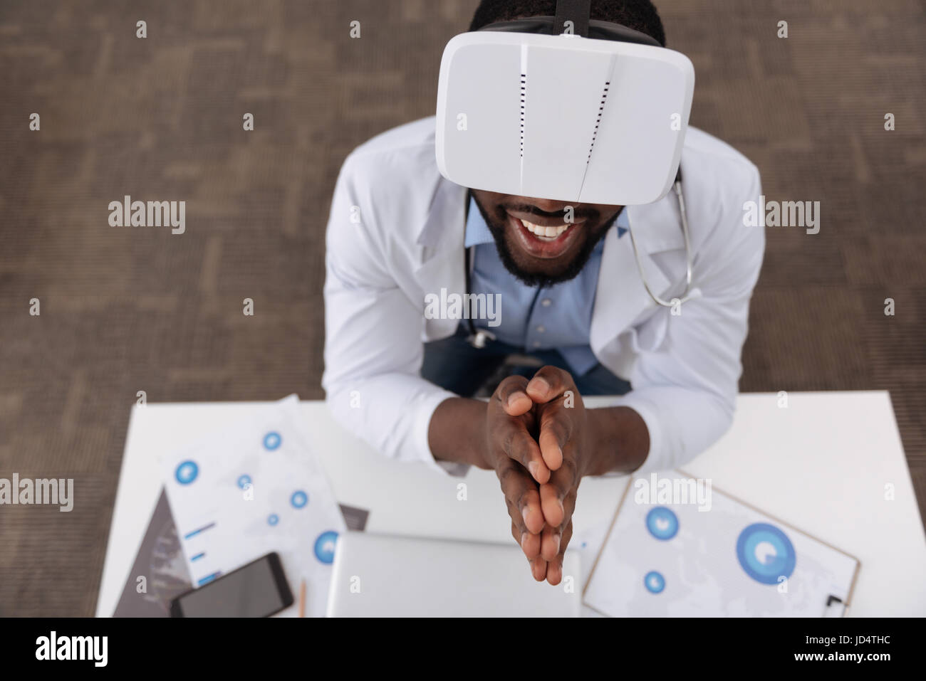 Nice delighted man holding his hands together Stock Photo - Alamy