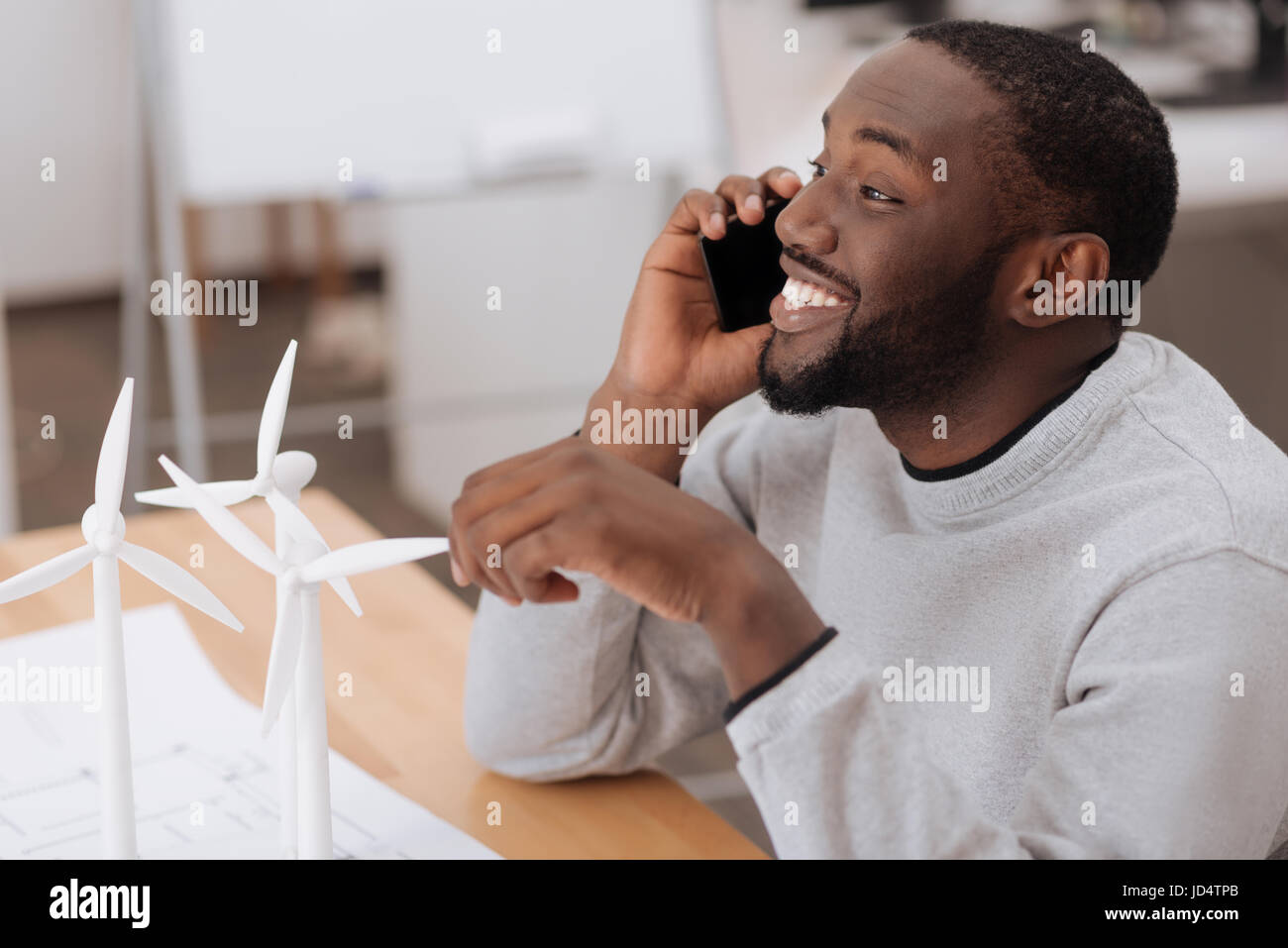 Joyful pleasant man being involved in the conversation Stock Photo - Alamy