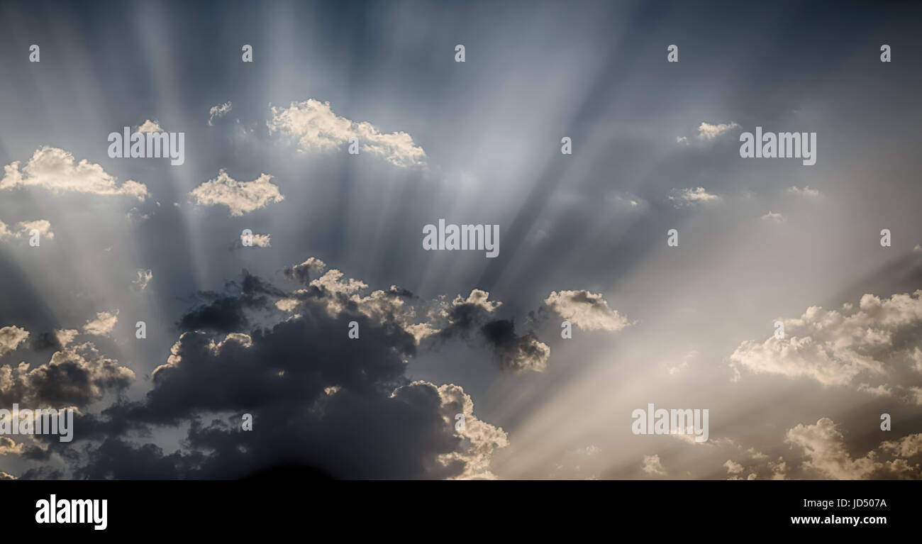 in the empty sky lots of clouds and sunny ray of light Stock Photo - Alamy