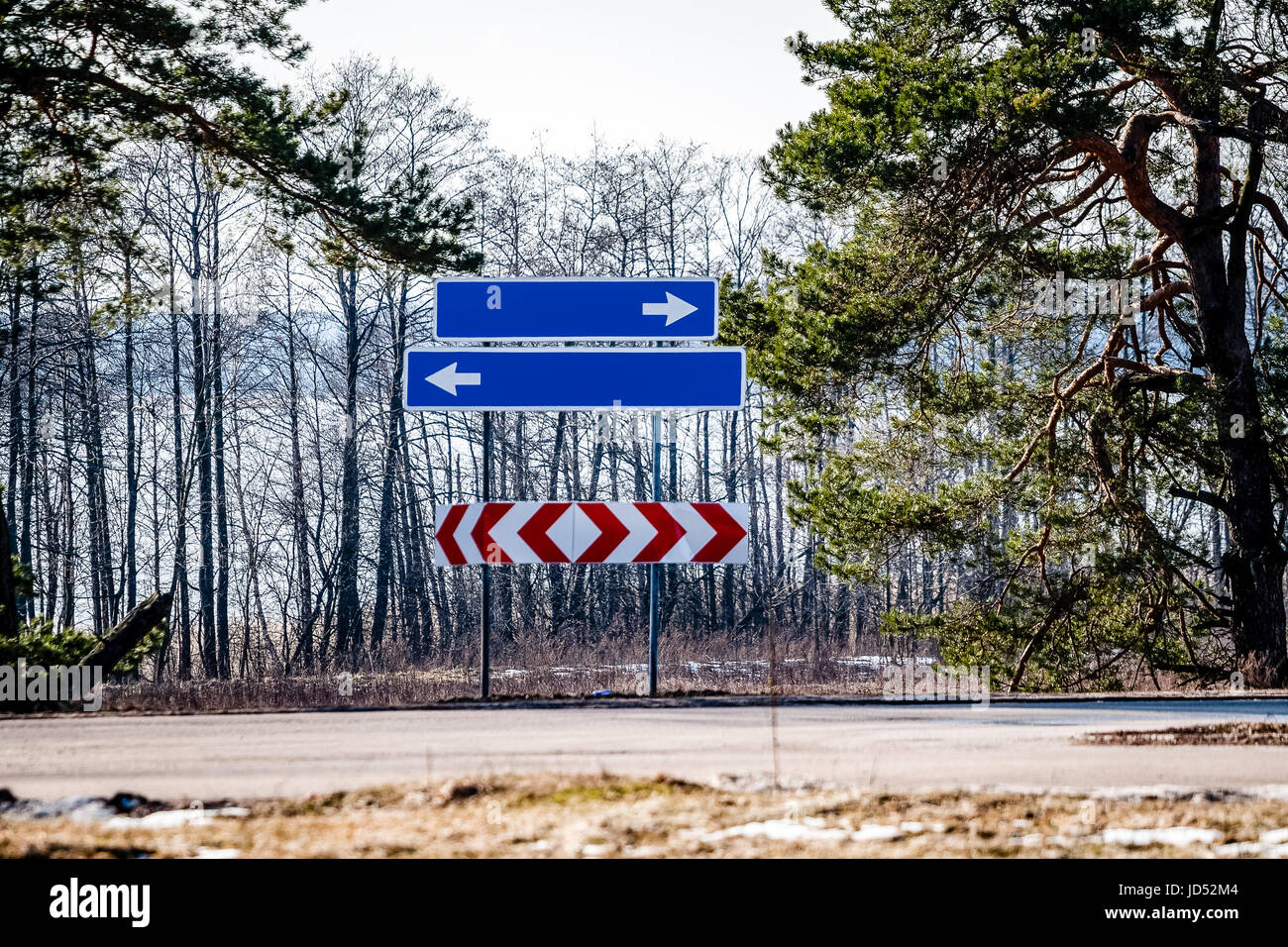road signs and lines on asphalt showing directions Stock Photo - Alamy