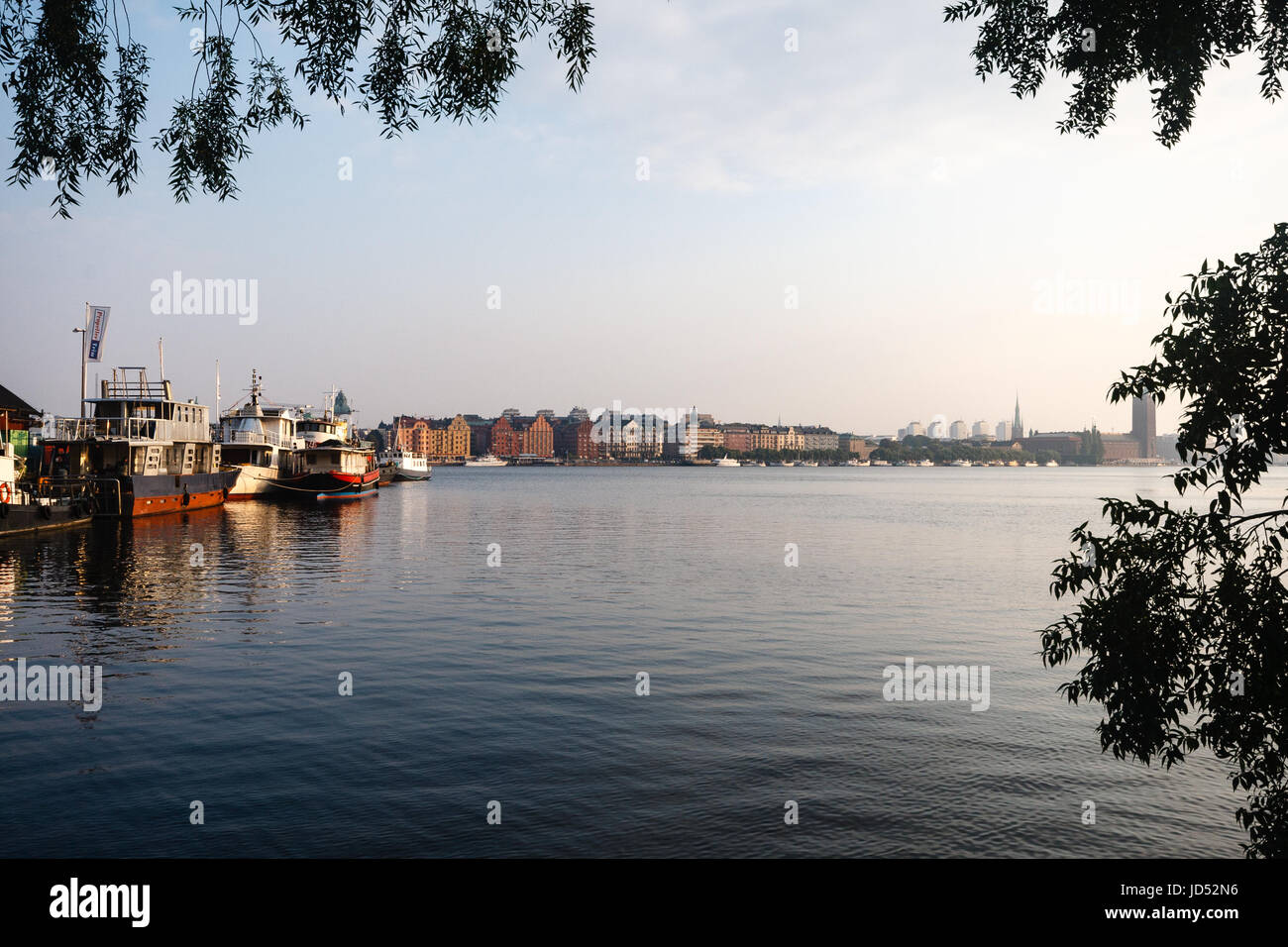 city light reflections over water at the colorful panorama Stock Photo ...