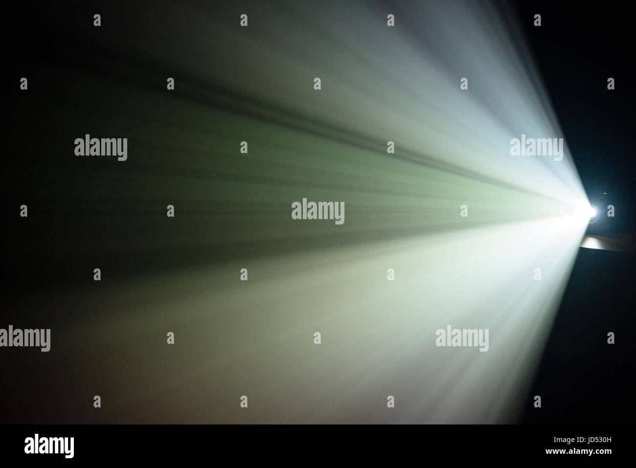 Ray of colorful light on a black background from projector Stock Photo ...