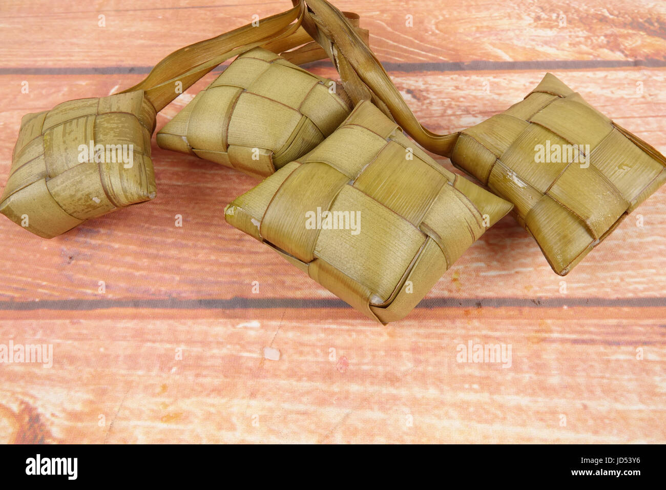 Malaysian dish Rendang Ayam or dry curry chicken and Ketupat Nasi (Rice ...