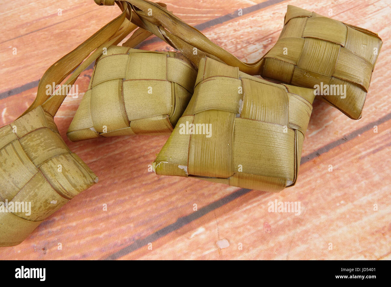 Malaysian dish Rendang Ayam or dry curry chicken and Ketupat Nasi (Rice ...