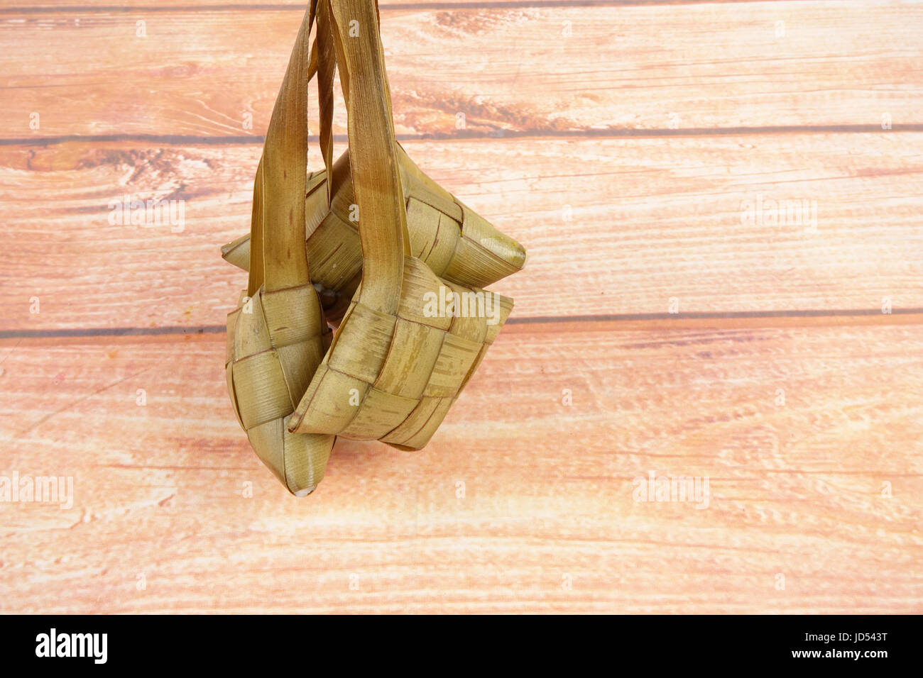 Malaysian dish Rendang Ayam or dry curry chicken and Ketupat Nasi (Rice ...