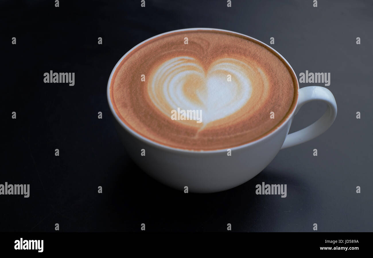 Vintage latte art coffee. Heart shape latter art in white cup Stock ...