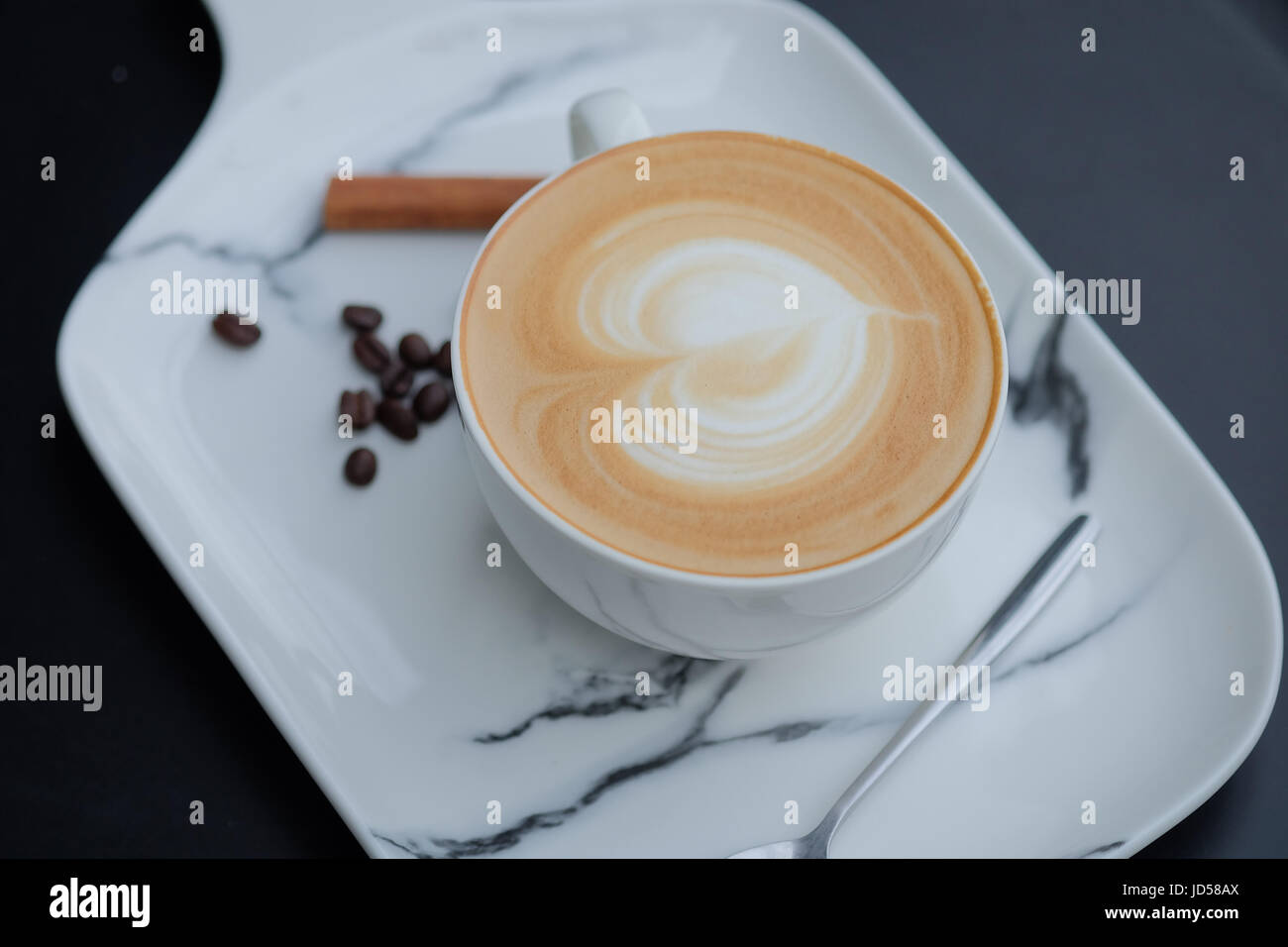 Latte art coffee. Heart shape latter art in white cup Stock Photo - Alamy
