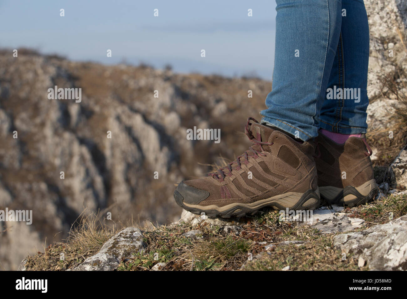 Hiking boot closeup on mountain rocks Stock Photo - Alamy