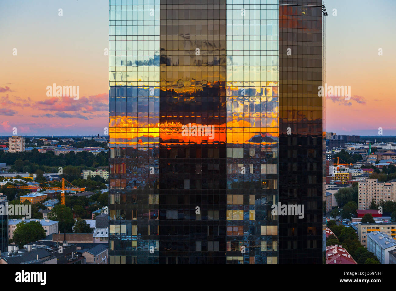 Modern business building reflects fire of sunset Stock Photo - Alamy