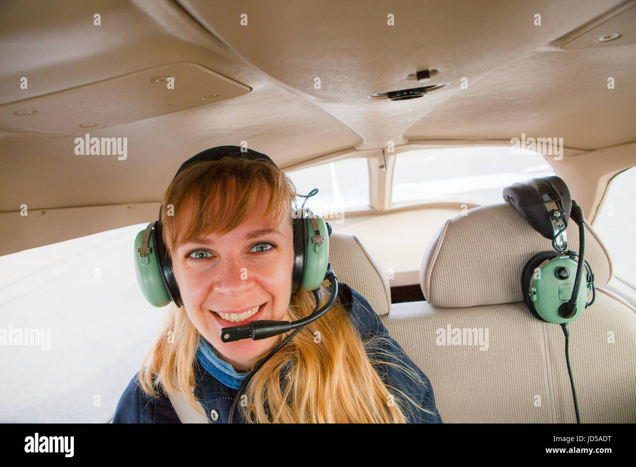 A woman flying an airplane Stock Photo - Alamy