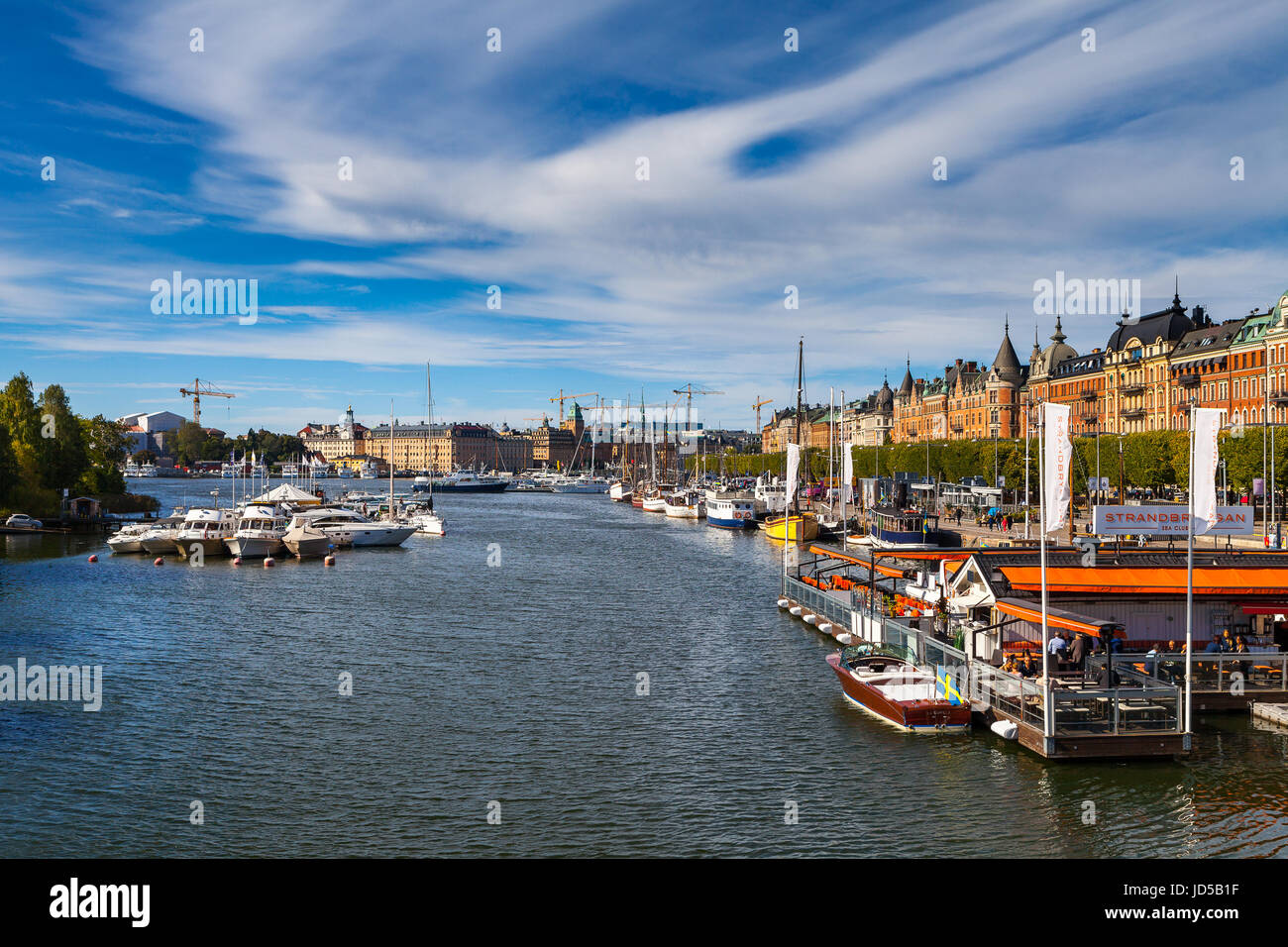 STOCKHOLM - SEPTEMBER, 15, 2016: Boats along small harbor in center of ...