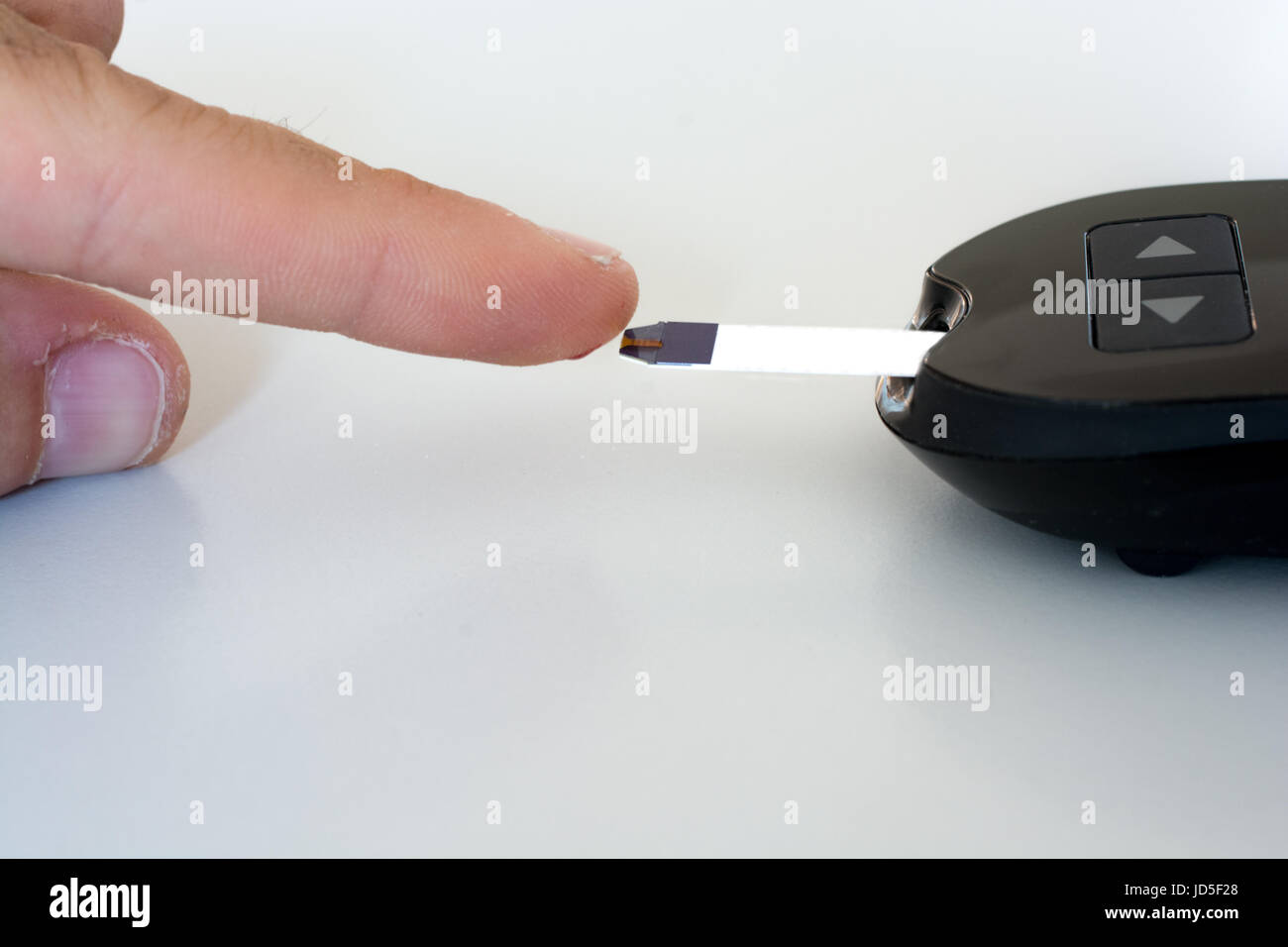 control of hyperglycemia using glucometer Stock Photo - Alamy