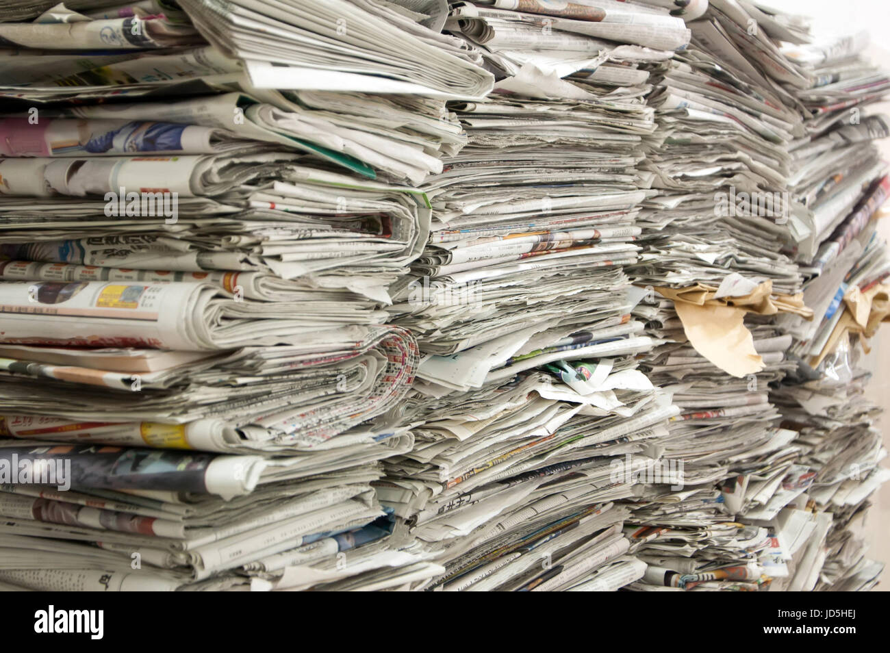 A pile of old newspapers, a bit dilapidated Stock Photo - Alamy
