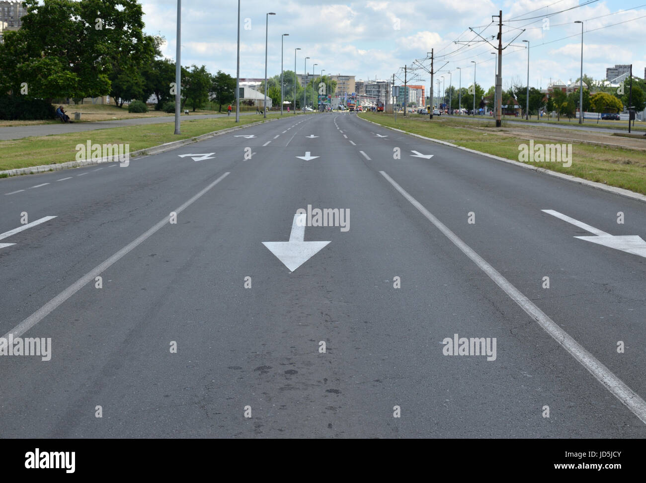 City street with street direction arrows and without cars Stock Photo ...