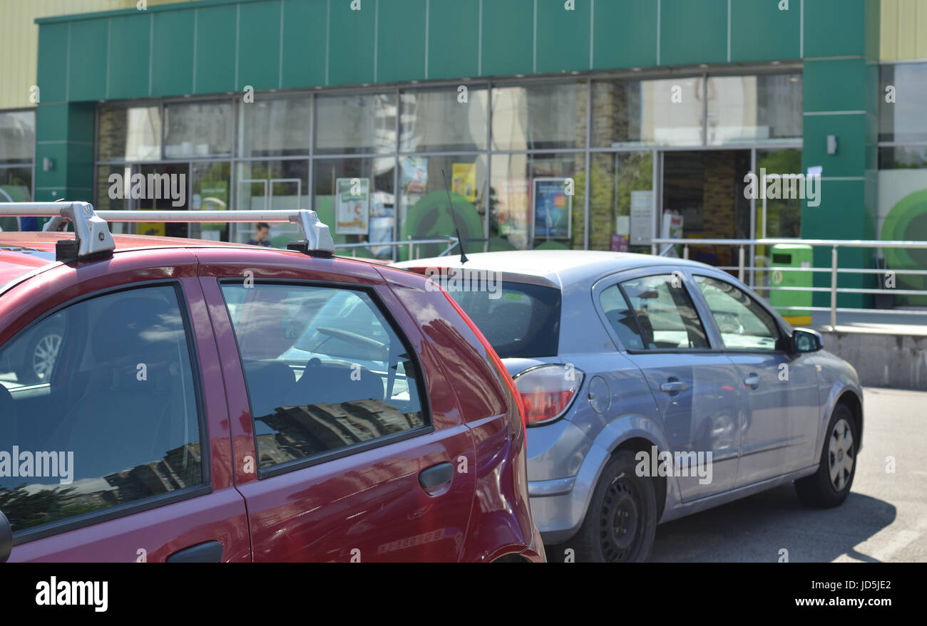Parked cars in front of a supermarket in an European city Stock Photo ...