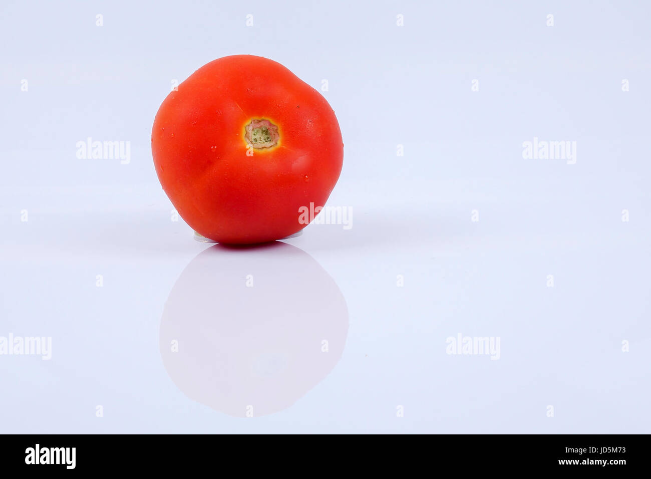 Ripe fresh tomato isolated on white Stock Photo - Alamy