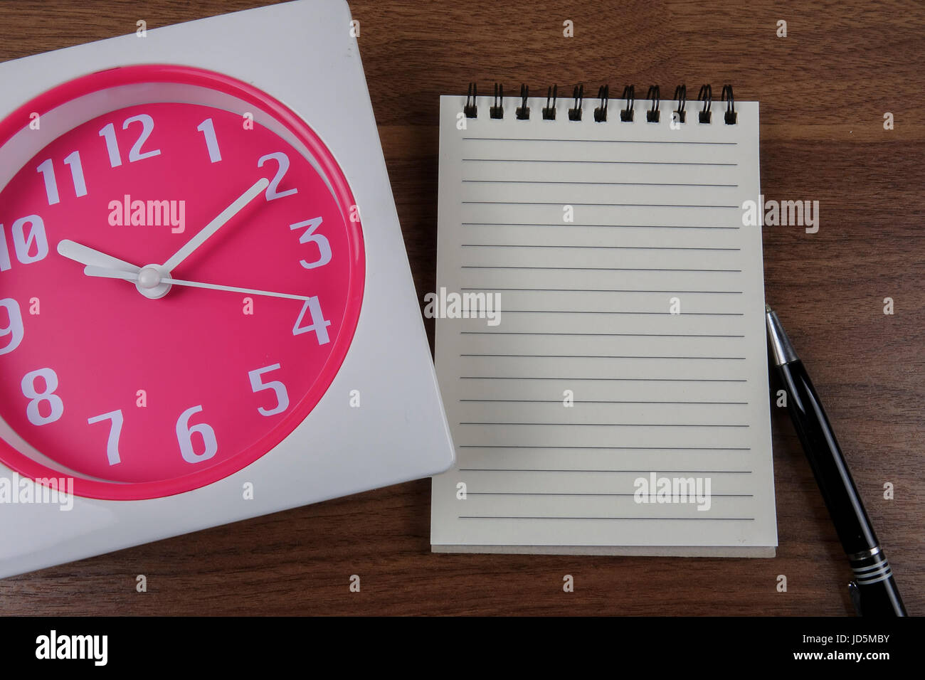 ime management conceptual,book,pen and clock on wood Stock Photo - Alamy