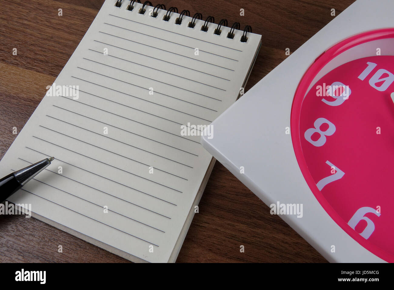 ime management conceptual,book,pen and clock on wood Stock Photo - Alamy