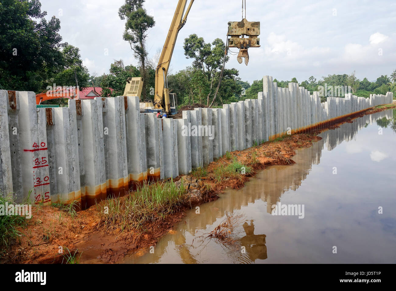 Piling machine works on a bridge pile construction Stock Photo - Alamy